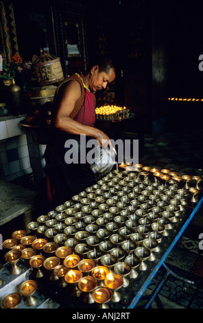 Pouring Oil Into Candles At Buddhist Temple, Chiang Mai, Thailand Stock ...