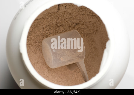 Open container of chocolate protein powder, view from above on white ...