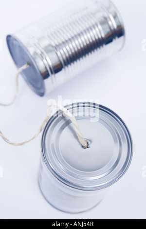 Tin Can Telephone with cut string Stock Photo - Alamy