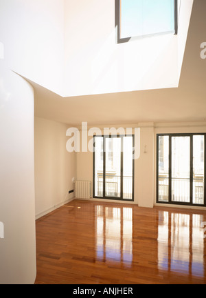 View of a spacious hall with hardwood flooring Stock Photo - Alamy