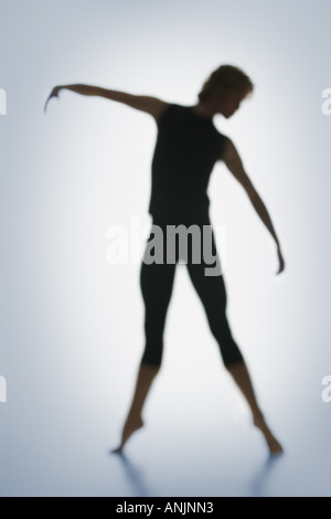 Blurred young ballet dancer posing on white background Stock Photo - Alamy