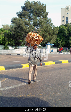 Egyptian man carrying bread in Cairo Stock Photo - Alamy