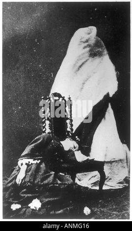 Florence Cook lies in trance, with a spirit form behind her, during a ...