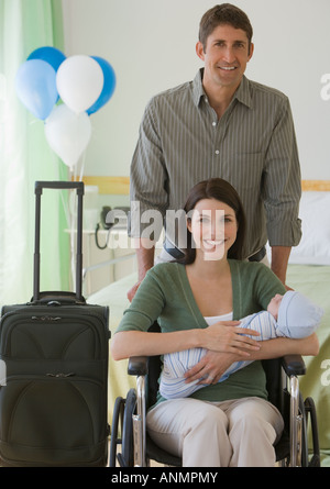 Parents leaving hospital with newborn Stock Photo - Alamy
