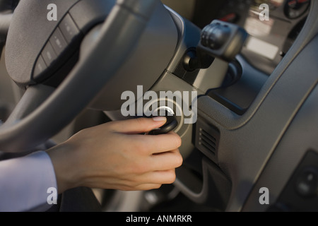 Hand turning car key in the key hole to start the car engine Stock ...