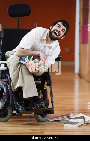 Funny man in wheelchair on white background Stock Photo - Alamy