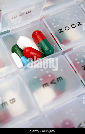 pills in daily pill boxes Stock Photo - Alamy