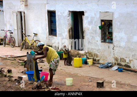 Woman washing clothes in Gambia river, Niokolo Koba national park ...