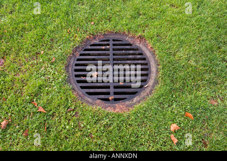 Cast iron storm drain grate Stock Photo - Alamy