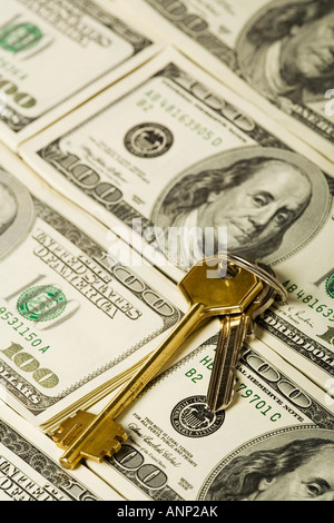 Stacks of 100 dollar bills with key Stock Photo - Alamy