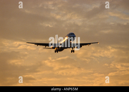 Airbus A320 is Approaching to Land at Sunset Stock Photo - Alamy