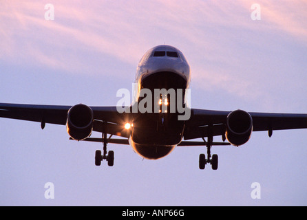 Airbus A320 is Approaching to Land at Sunset Stock Photo - Alamy