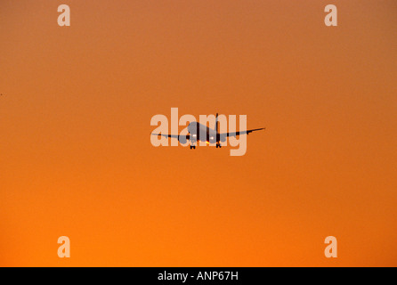 Airbus A320 is Approaching to Land at Sunset Stock Photo - Alamy