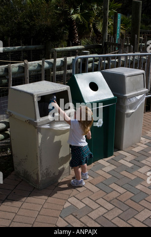 Little Girl Disposing of Garbage Stock Photo - Alamy
