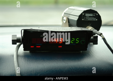Police speed radar unit in police car driving on 2 lane road Stock ...