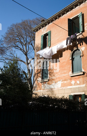 Traditional house with ochre walls and wooden door and window, in the ...