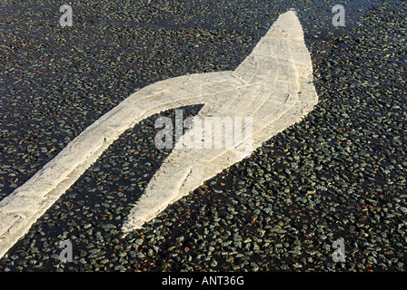 Turning right ahead Arrow Road markings on box junction Stock Photo - Alamy