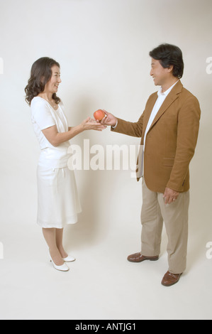 Studio shot of Japanese man giving ok sign Stock Photo - Alamy