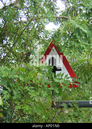 road traffic sign concealed by leaves Stock Photo - Alamy
