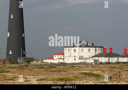 The old lighthouse and white buildings at Dungeness in Kent, UK Stock ...