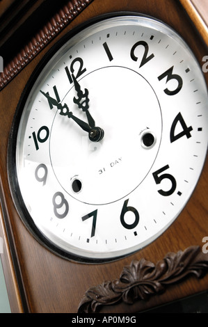 Clock showing five minutes to twelve Stock Photo - Alamy