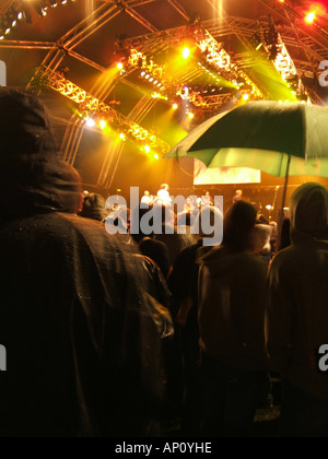 couple and crowd in concert in pouring rain Stock Photo - Alamy