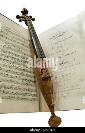 Antique stringed musical instrument is bowed at Renaissance Faire Stock ...