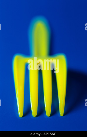 focused plastic yellow fork Stock Photo - Alamy