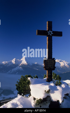 cross on the summit Kneifelspitze with watzmann and hochkalter in the ...