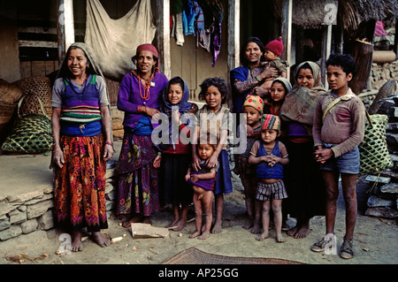 A smiling GURUNG FAMILY mostly female in the yard of their traditional ...
