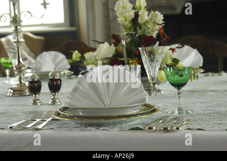 Victorian dining table setting, silver service place settings in a ...