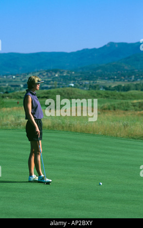 Golfer putting Haymaker golf course Steamboat Springs Colorado USA ...