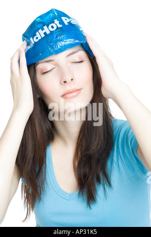 Female with compress on forehead suffering fever, nurse looking after ...