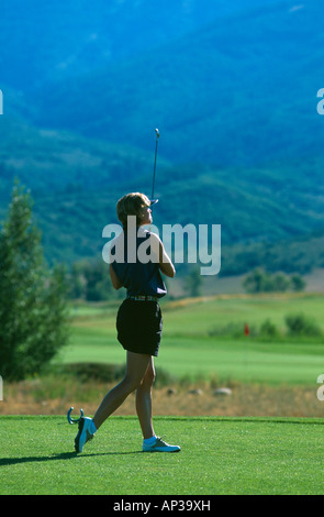Golfer teeing off Haymaker golf course Steamboat Springs Colorado USA ...