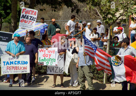 White & Hispanic demonstrators minority day laborers at a hiring center ...