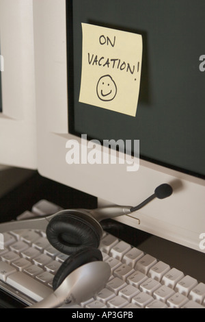 On vacation sticker on computer screen workstation Stock Photo - Alamy
