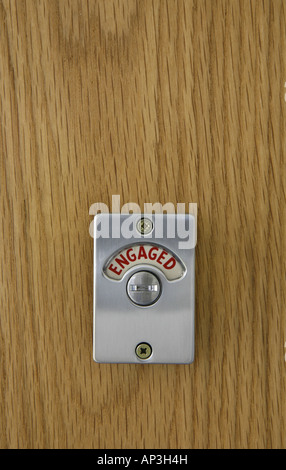 Engaged toilet door sign Stock Photo - Alamy