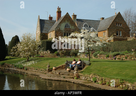 Coton Manor, a 17th century manor house, surrounded by landscaped ...