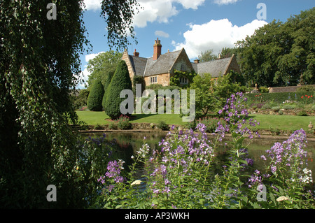 Coton Manor, a 17th century manor house, surrounded by landscaped ...