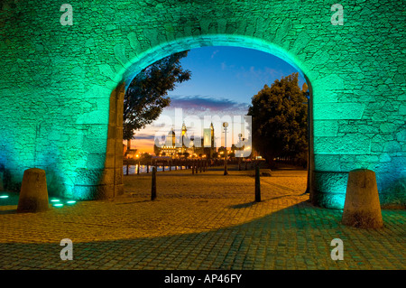 View through the Wapping Arch at night showing the Albert Dock ...
