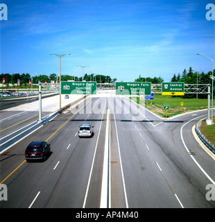 Directional QEW signs to Toronto and Niagara on Lakeshore Road in ...