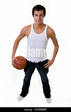 Young Man Ready to Shoot Hoops and Take on the Competition on the ...