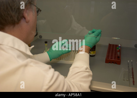Toxicologist testing blood for traces of poison Stock Photo - Alamy