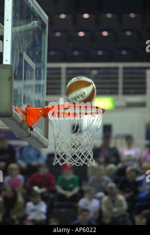 Basketball scoring in hoop Stock Photo - Alamy
