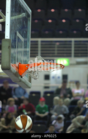 Basketball scoring in hoop Stock Photo - Alamy