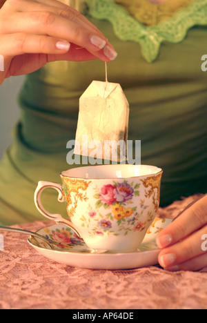 Some quiet time with a cup of tea. Shot of an attractive young woman ...