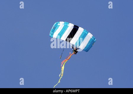 A Skydiver floats to earth using a new style rectangular parachute ...