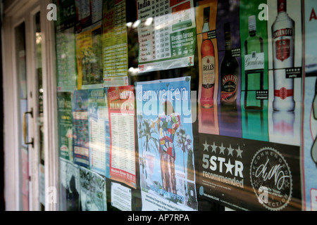 Newsagents shop window Stock Photo - Alamy