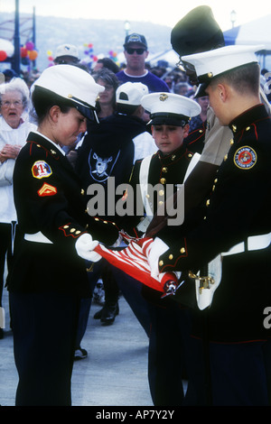 US Marines fold an American Flag during the Burial at Sea Ceremony for ...