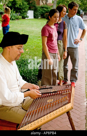 re enactor plays hammer dulcimer a popular Colonial instrument ...